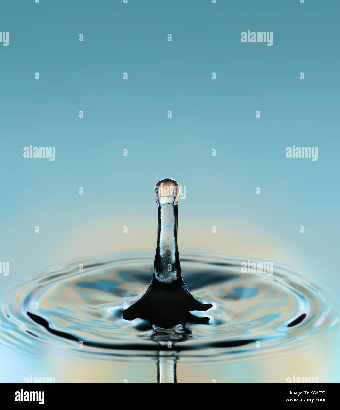 Colored water drop splash Stock Photo - Alamy