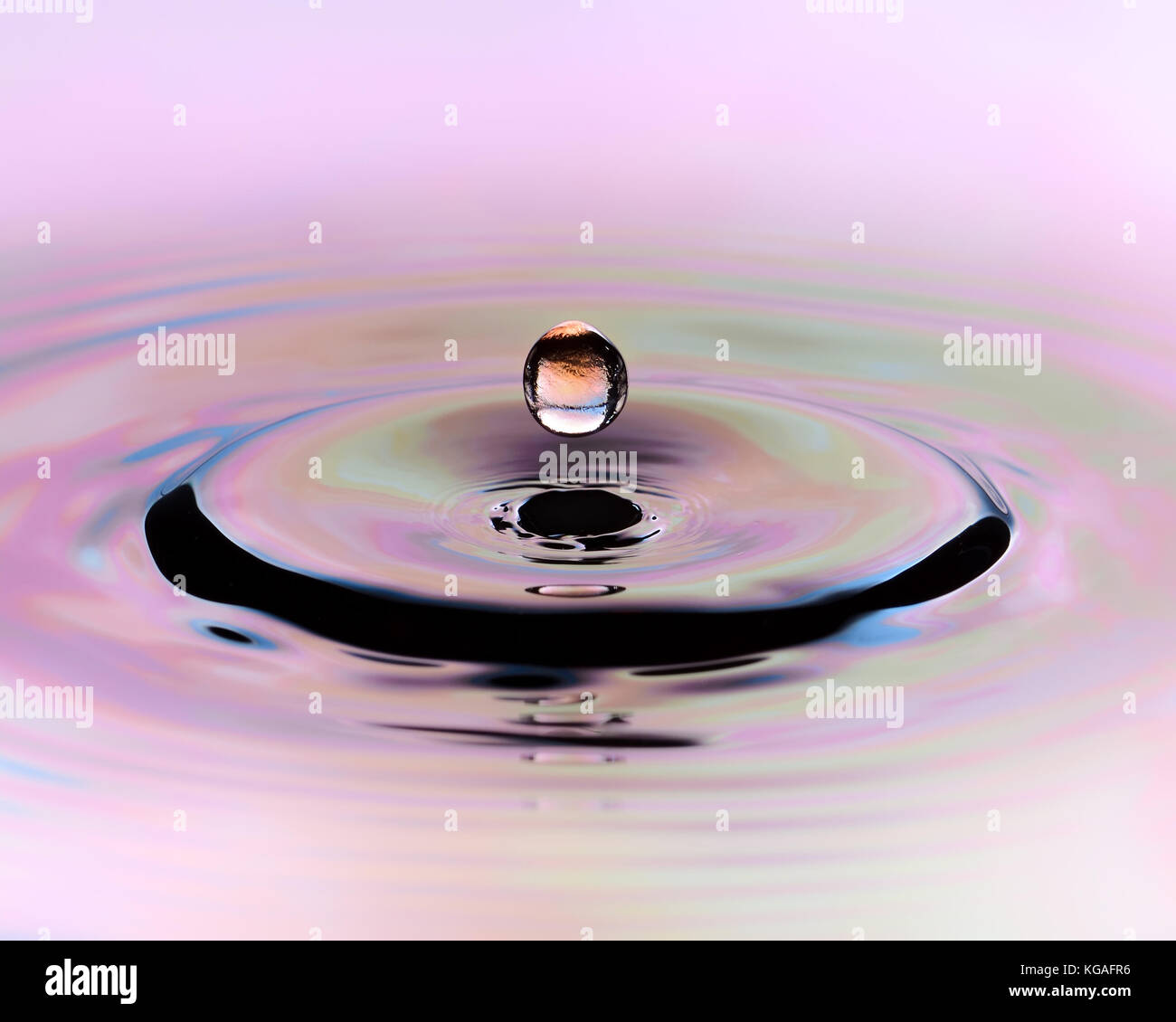 Colored water drop splash Stock Photo - Alamy