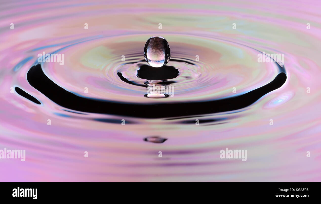 Colored water drop splash Stock Photo - Alamy