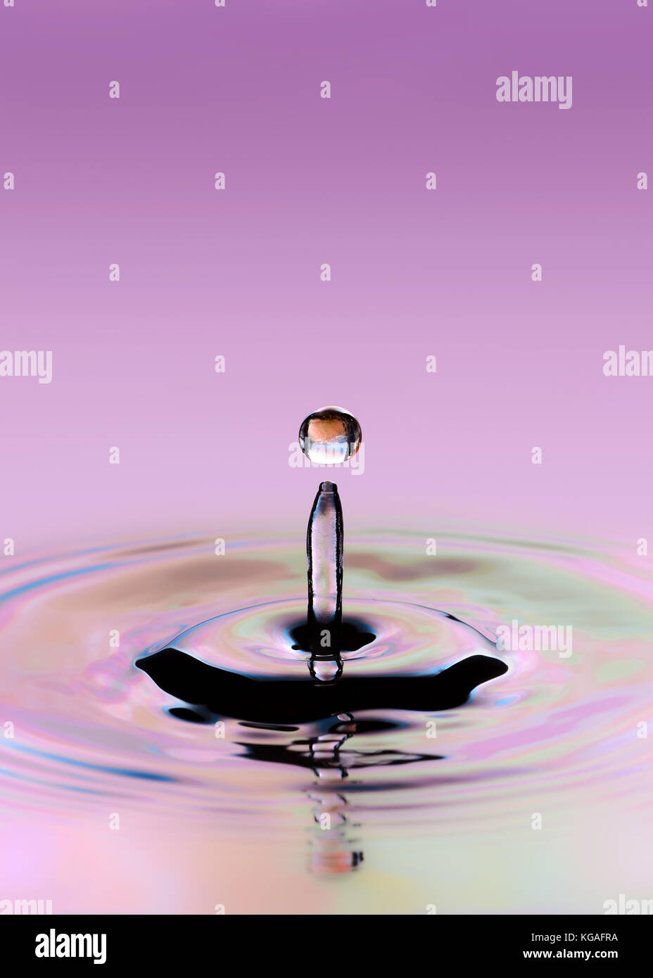 Colored water drop splash Stock Photo - Alamy