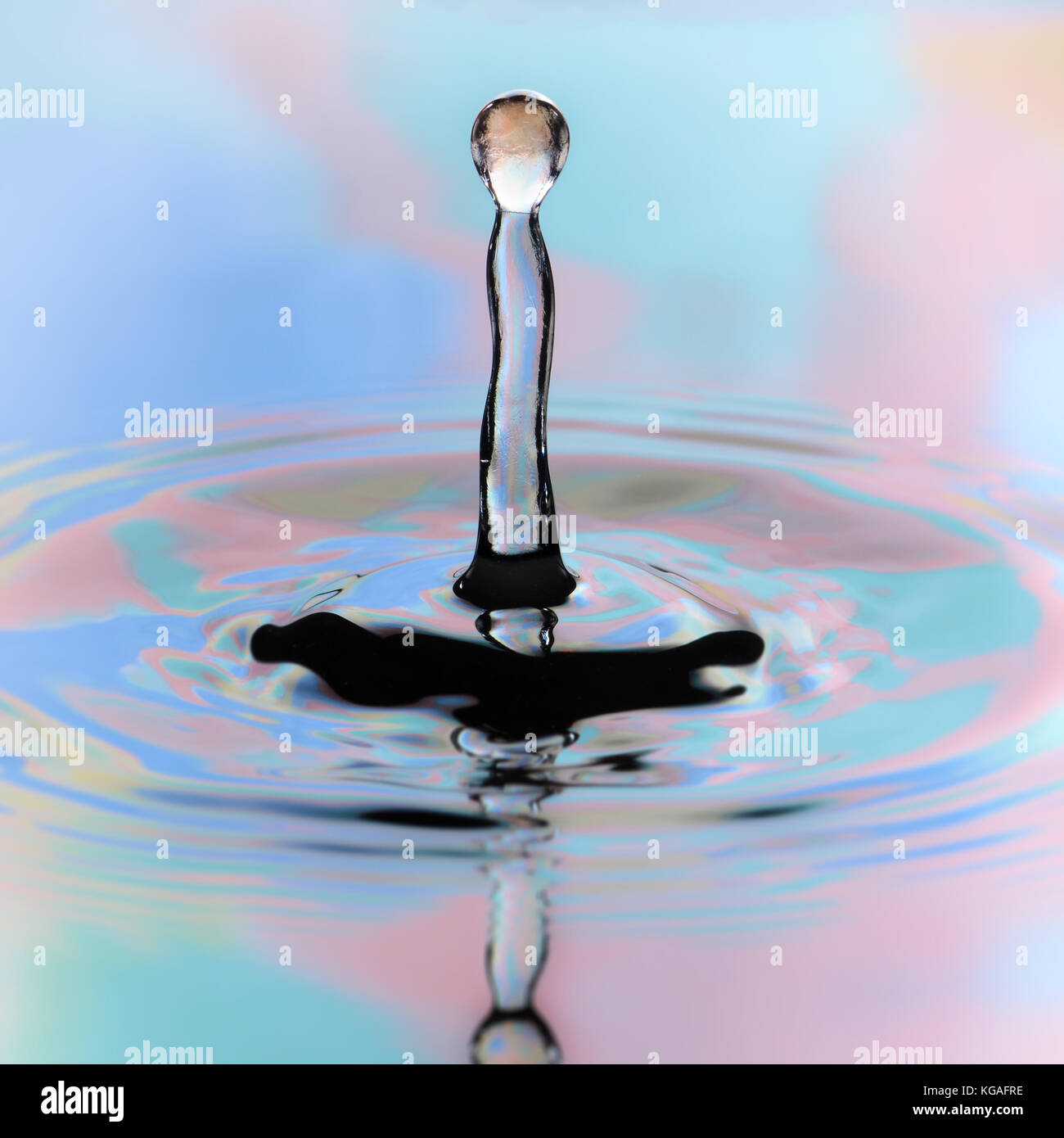 Colored water drop splash Stock Photo - Alamy