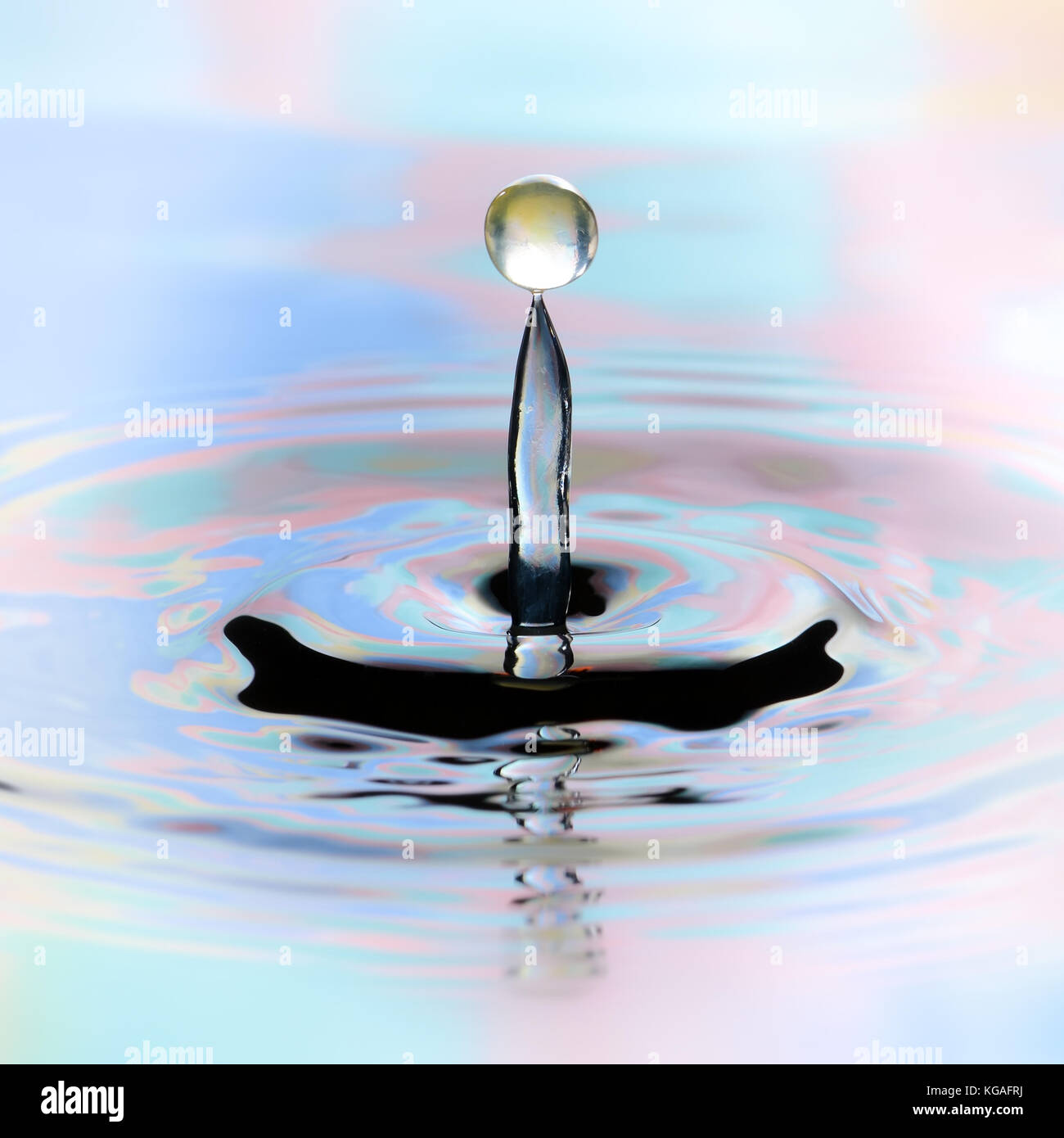 Colored water drop splash Stock Photo - Alamy