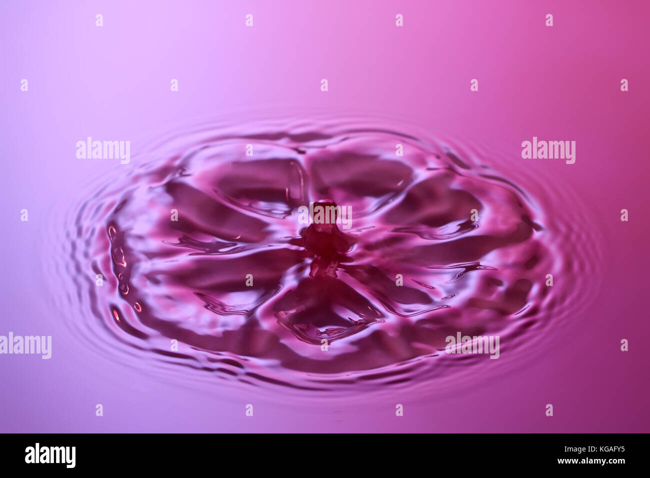 Colored water drop splash Stock Photo - Alamy