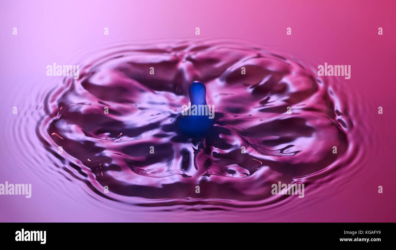 Colored water drop splash Stock Photo - Alamy