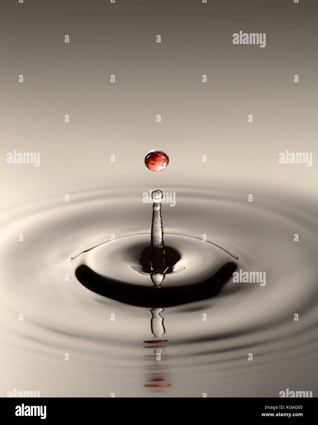 Cherry juice drop splash in water Stock Photo - Alamy