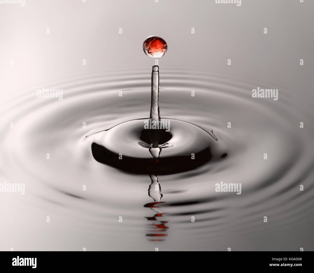 Cherry juice drop splash in water Stock Photo - Alamy