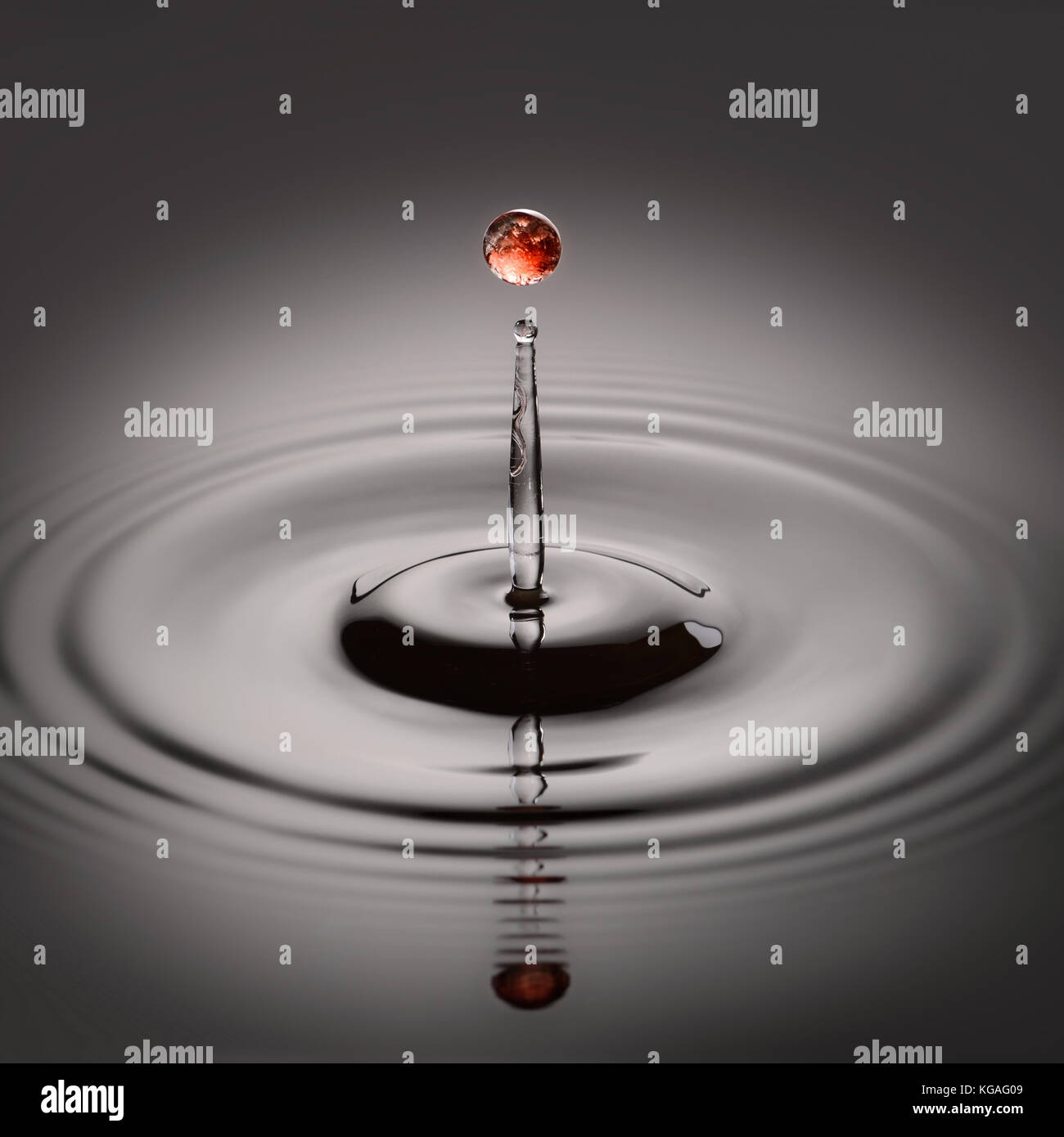 Cherry juice drop splash in water Stock Photo - Alamy