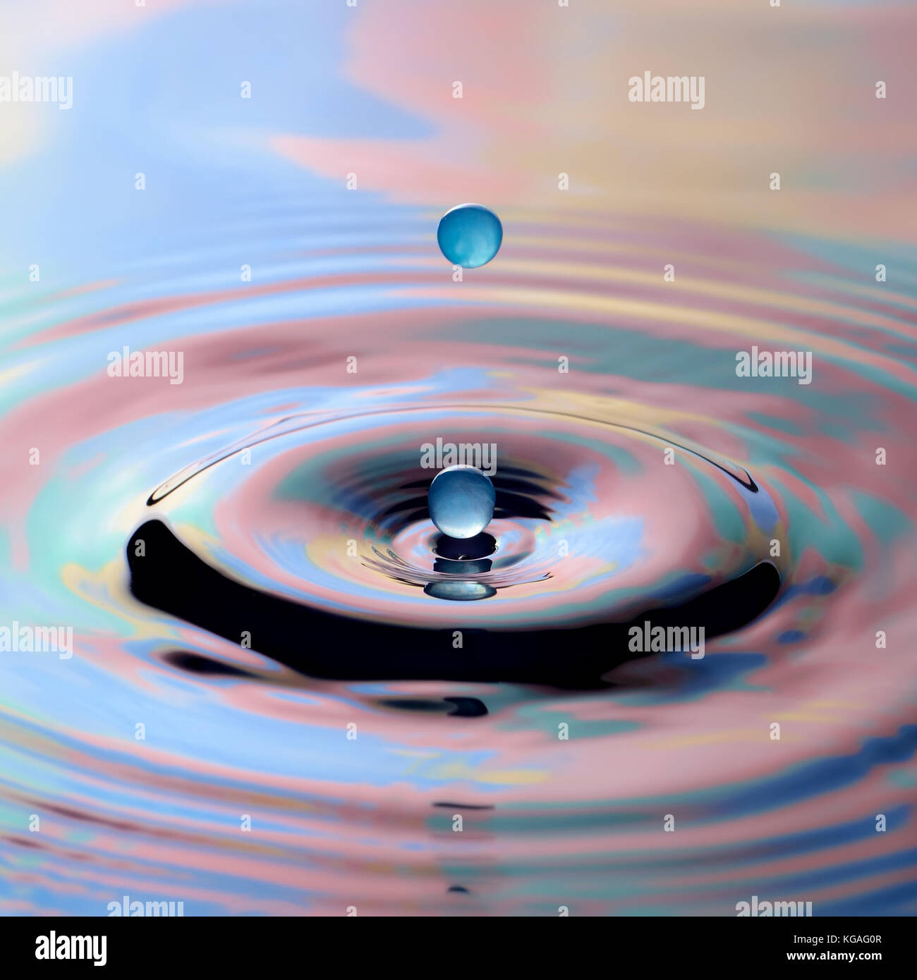Colored water drop splash Stock Photo - Alamy