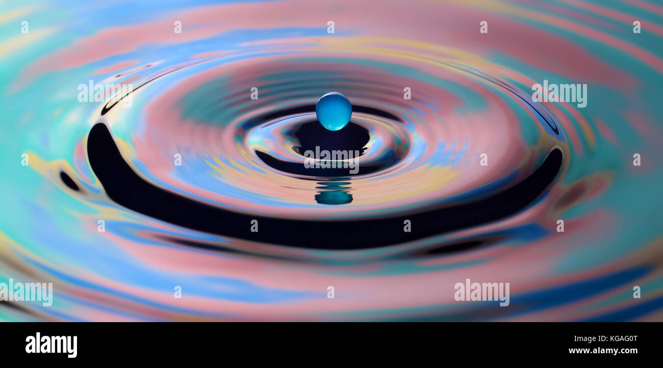 Colored water drop splash Stock Photo - Alamy