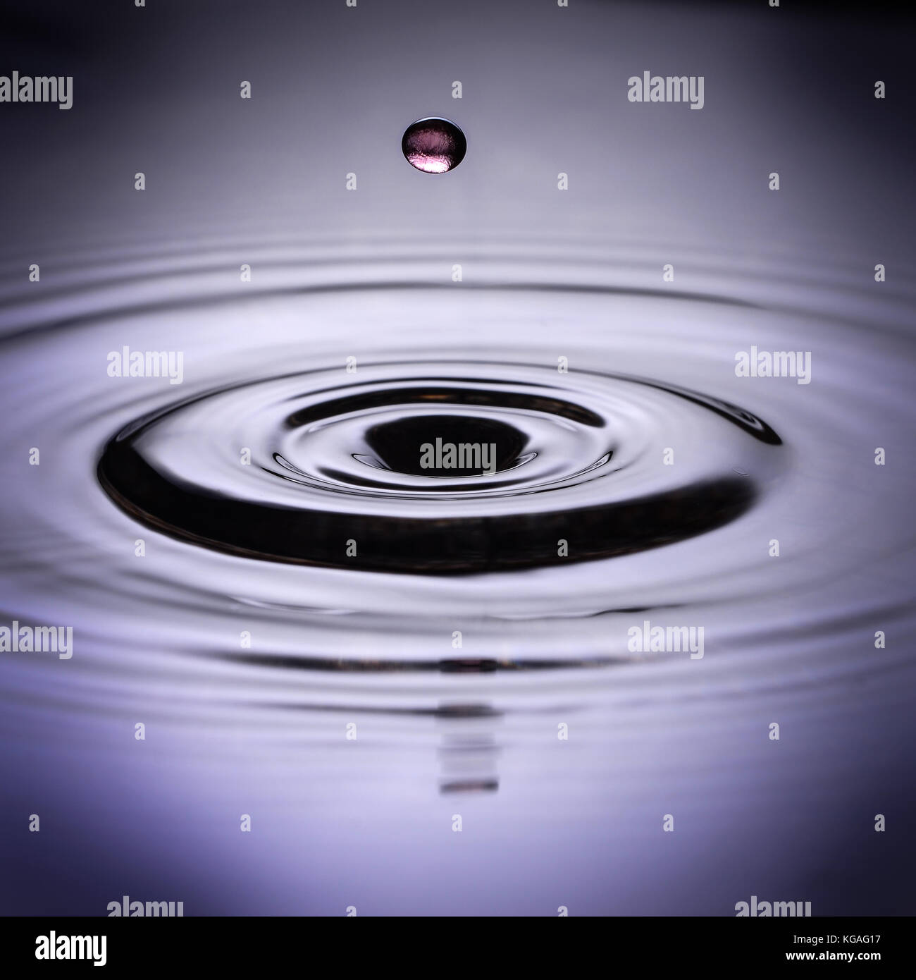 Colored water drop splash Stock Photo - Alamy