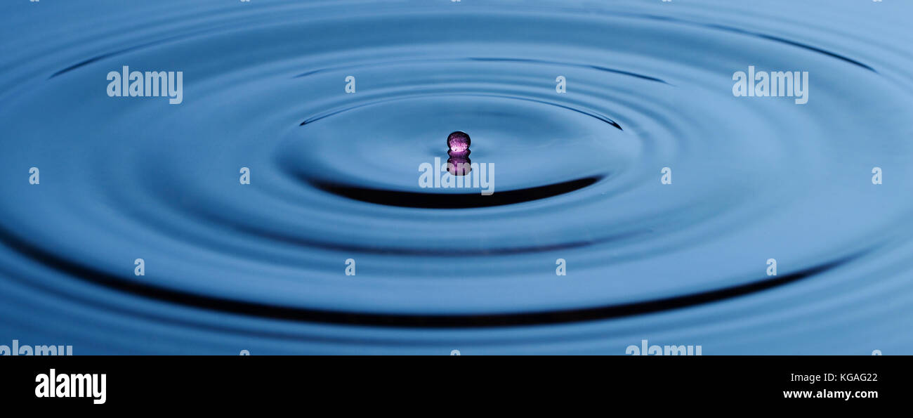 Colored water drop splash Stock Photo - Alamy