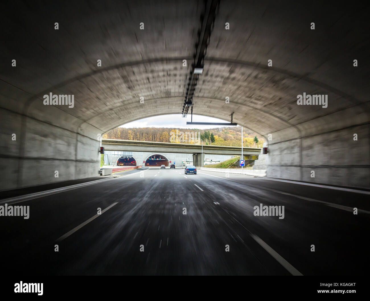 Wide tunnel on a freeway with moving cars Stock Photo - Alamy