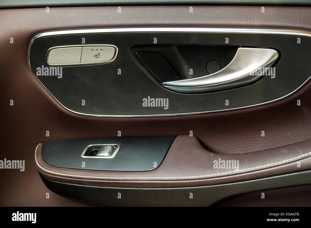 Modern car door handle and window control switch Stock Photo - Alamy