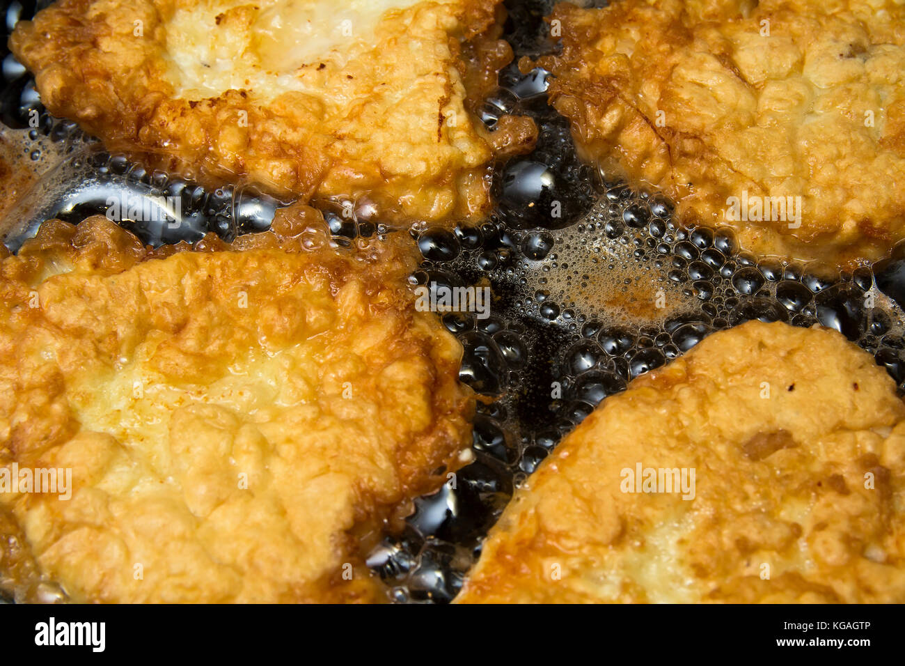 Close-up of meet preparing in frying pan Stock Photo - Alamy