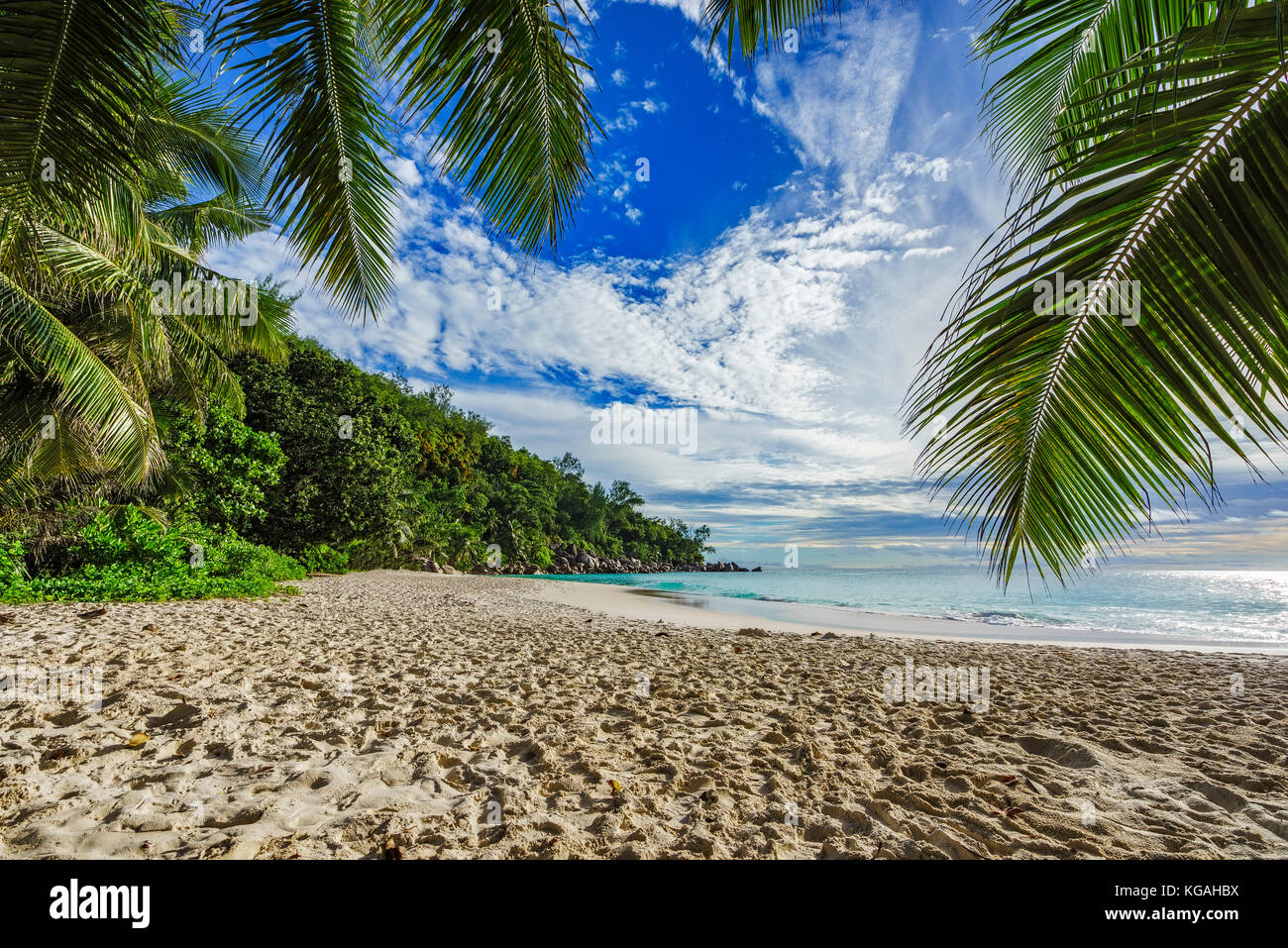 sunny day on paradise beach with big granite rocks, turquoise water ...