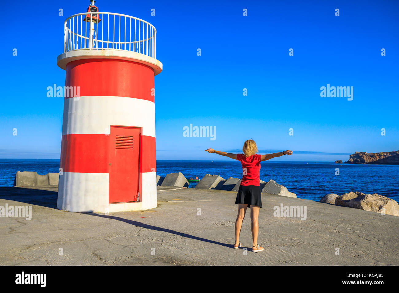 Woman at Nazare Lighthouse Stock Photo - Alamy