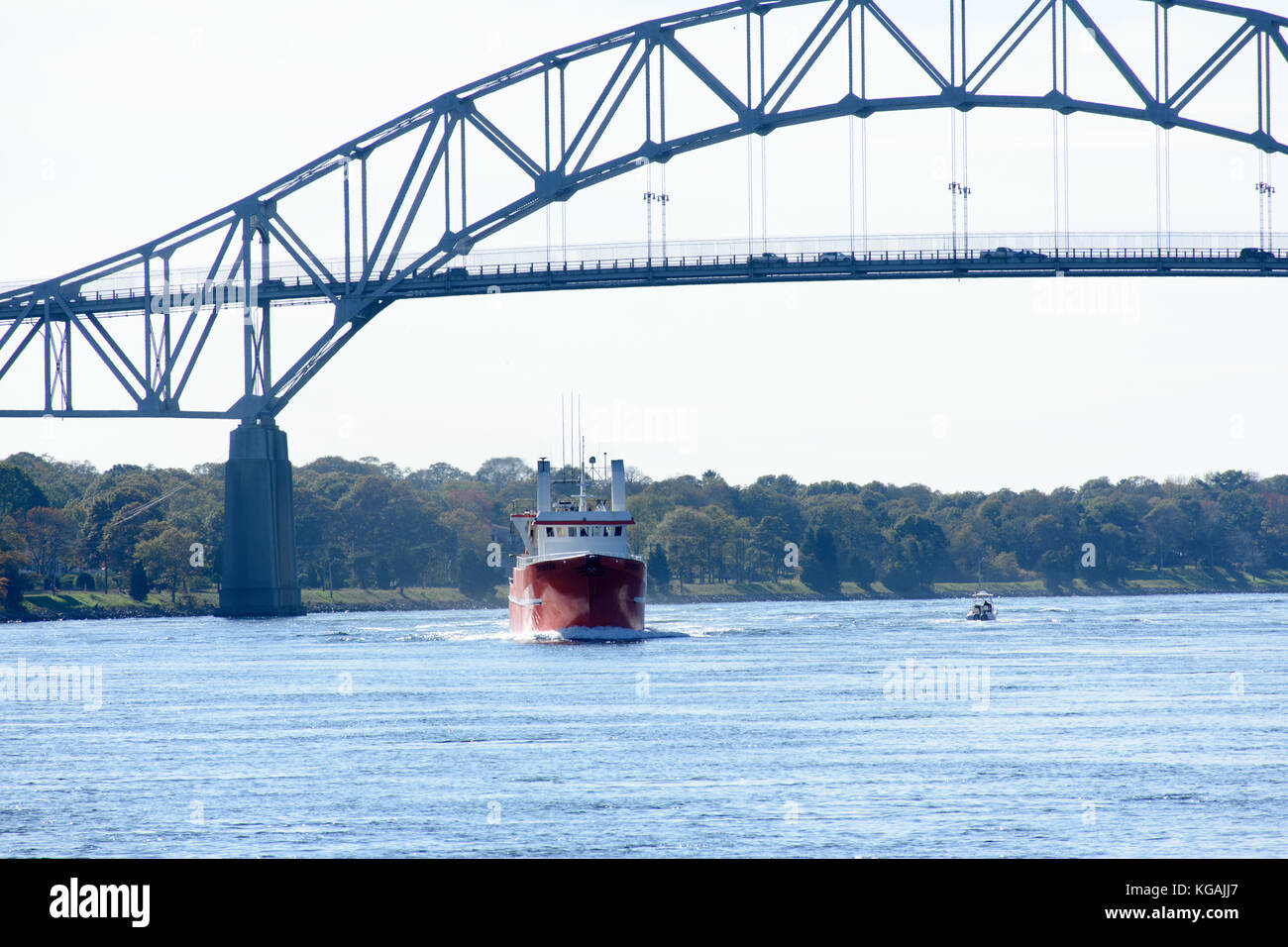 Commercial fishing vessel passing under the Bourne Bridge while ...