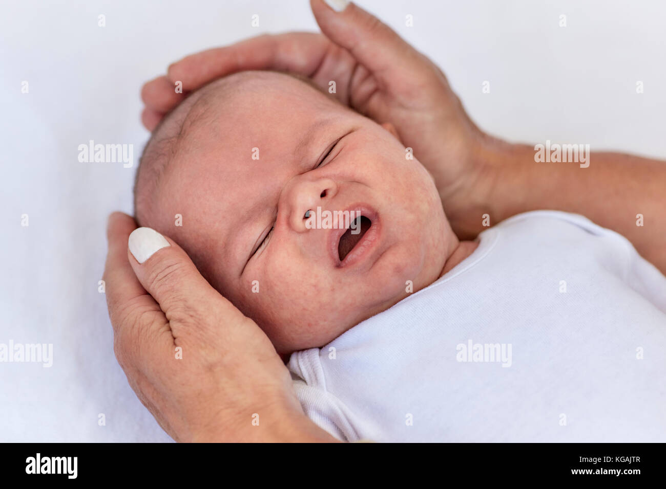 Cradling infant hi-res stock photography and images - Alamy