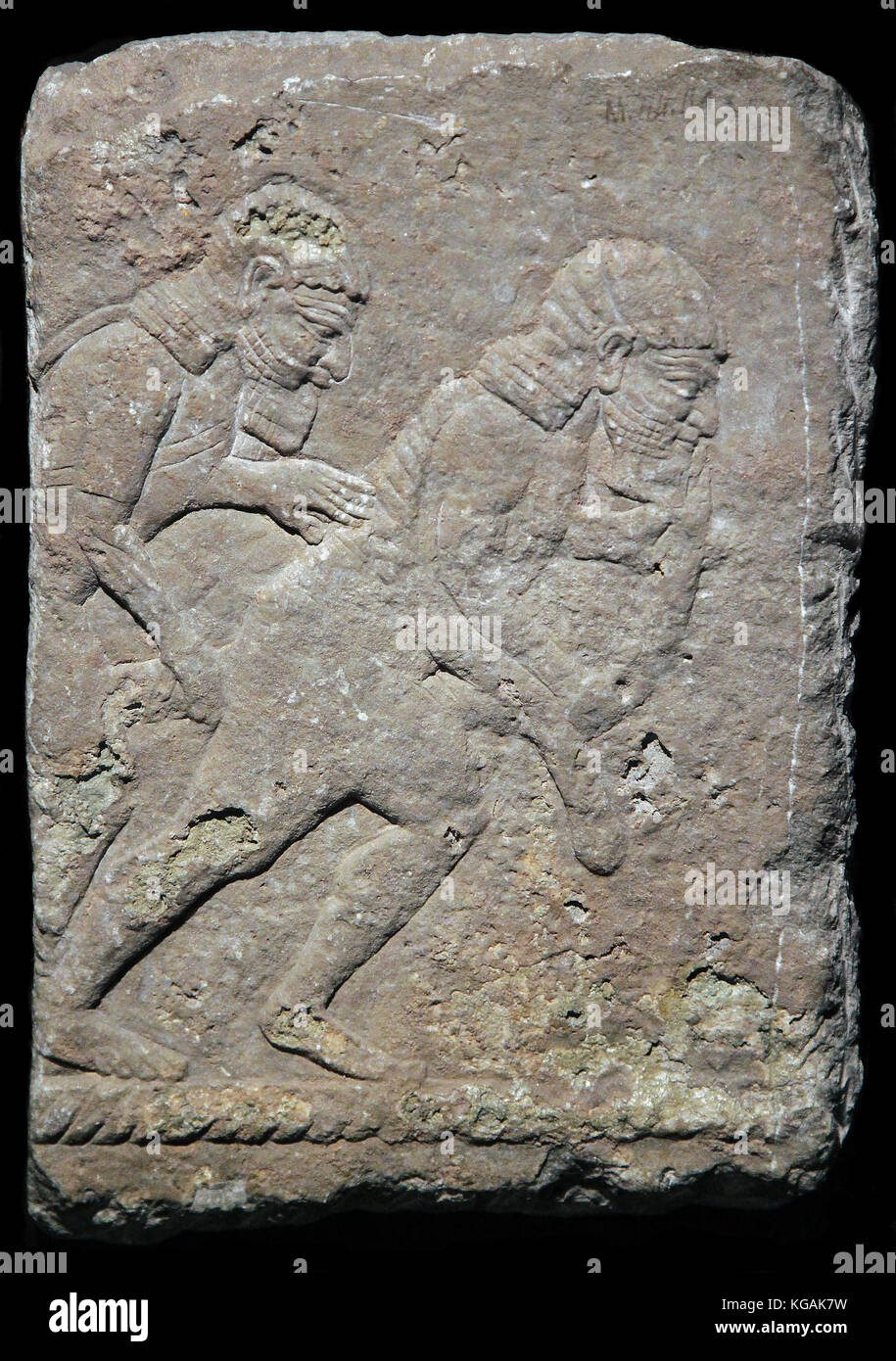 Nineveh.Alabaster relief showing workmen moving colosaal lamassus or ...