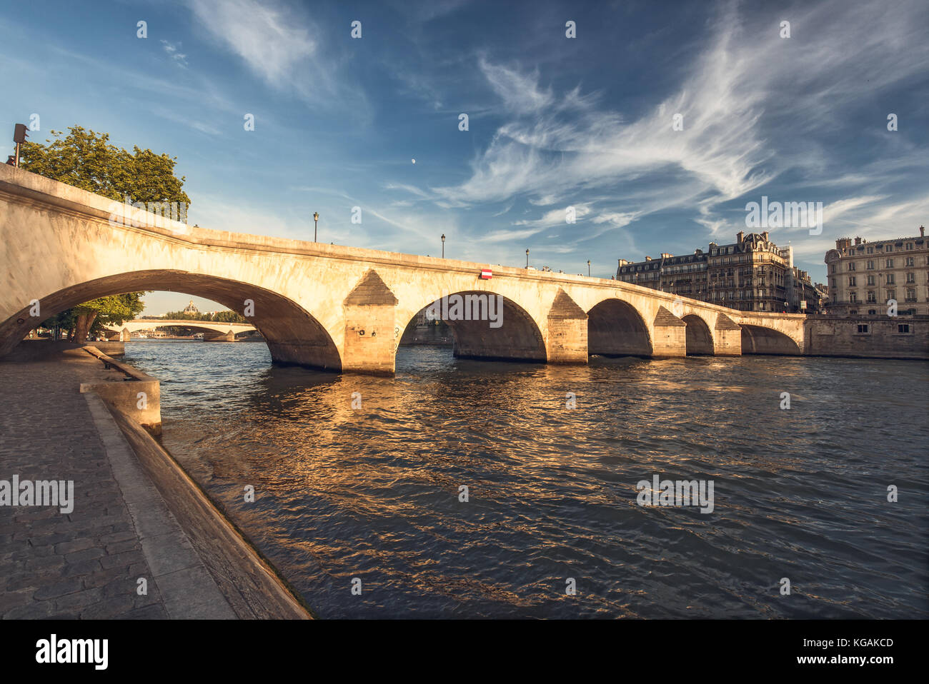 Bridge over river Seine in Paris, France at daytime viewed from a quay ...
