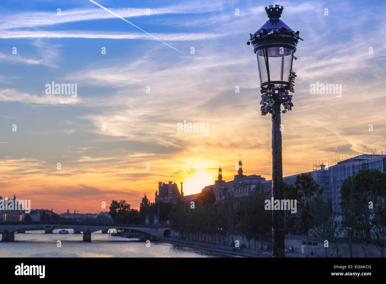 Sunset over Paris, France with Pont des Arts and the river Seine ...