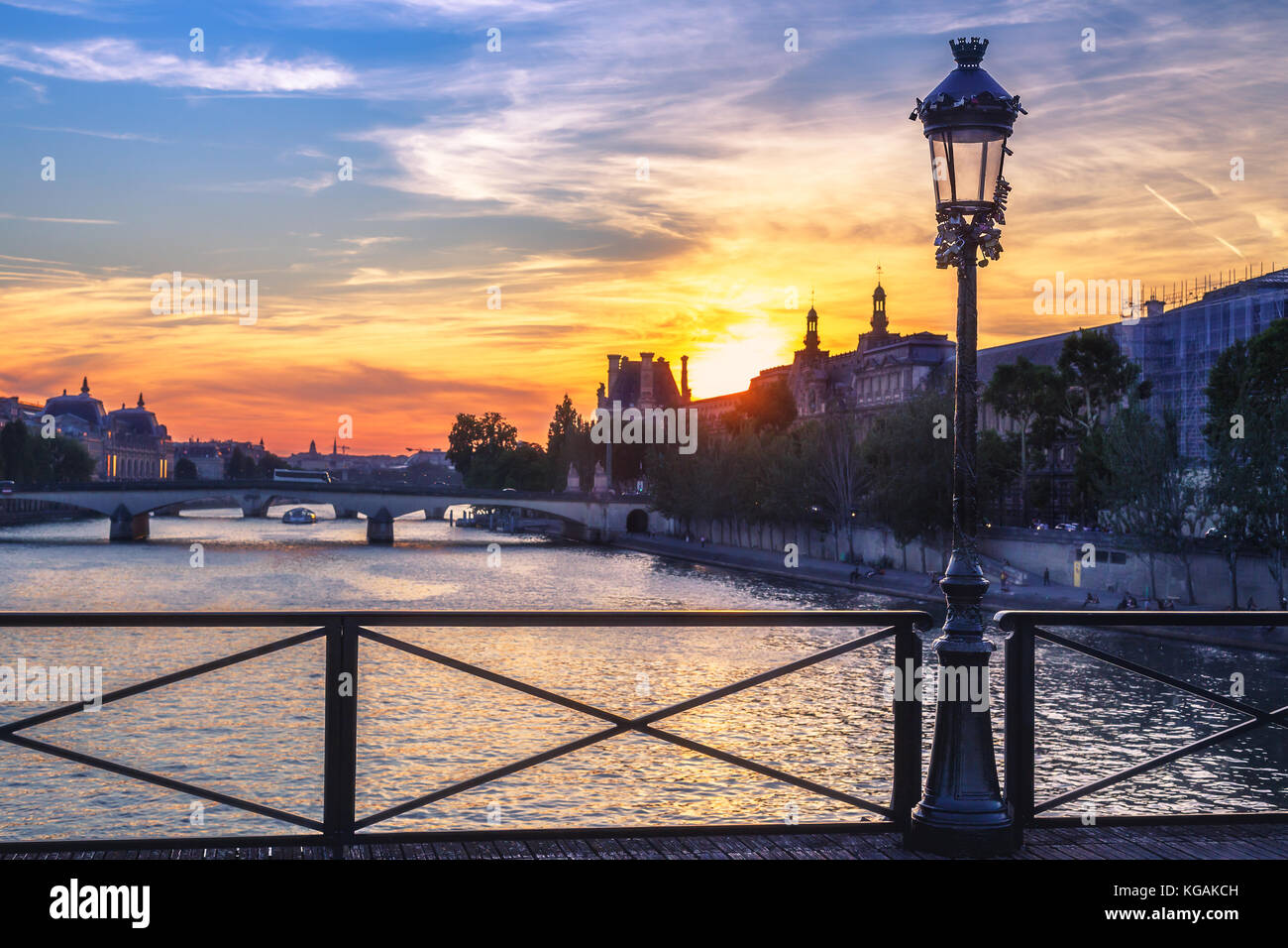 Colourful sunset over Paris, France, seen from Pont des Arts. Romantic ...
