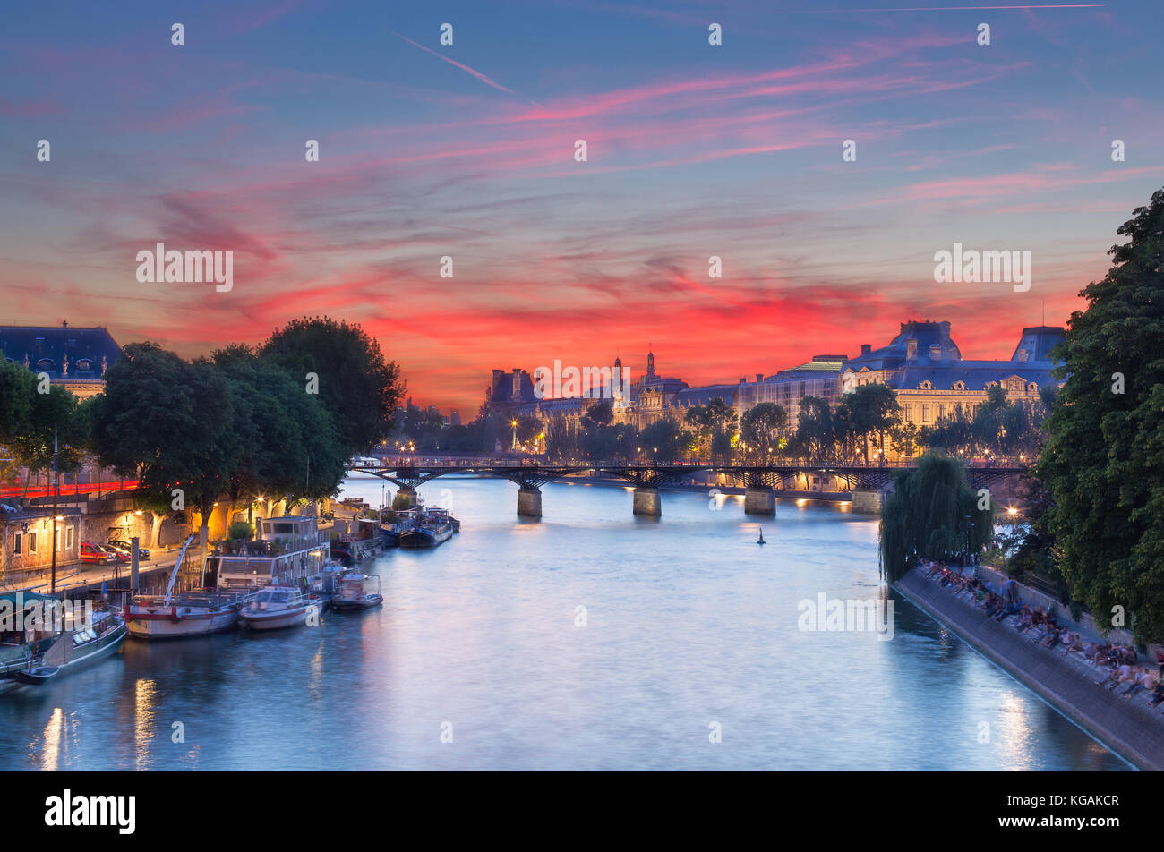 Dramatic sunset over river Seine in Paris, France, with Pont des Arts ...