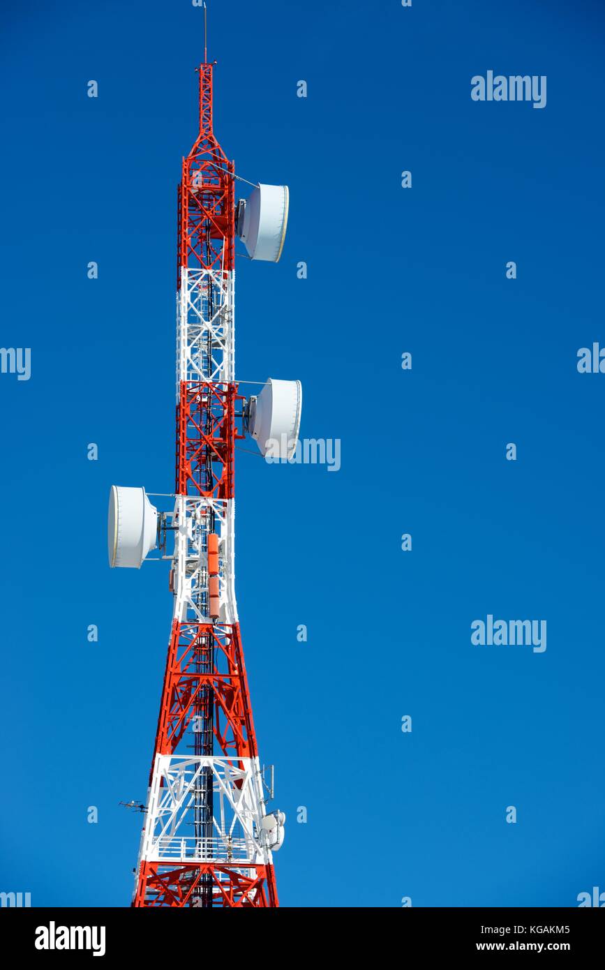 Telecommunications tower with clear blue sky Stock Photo - Alamy