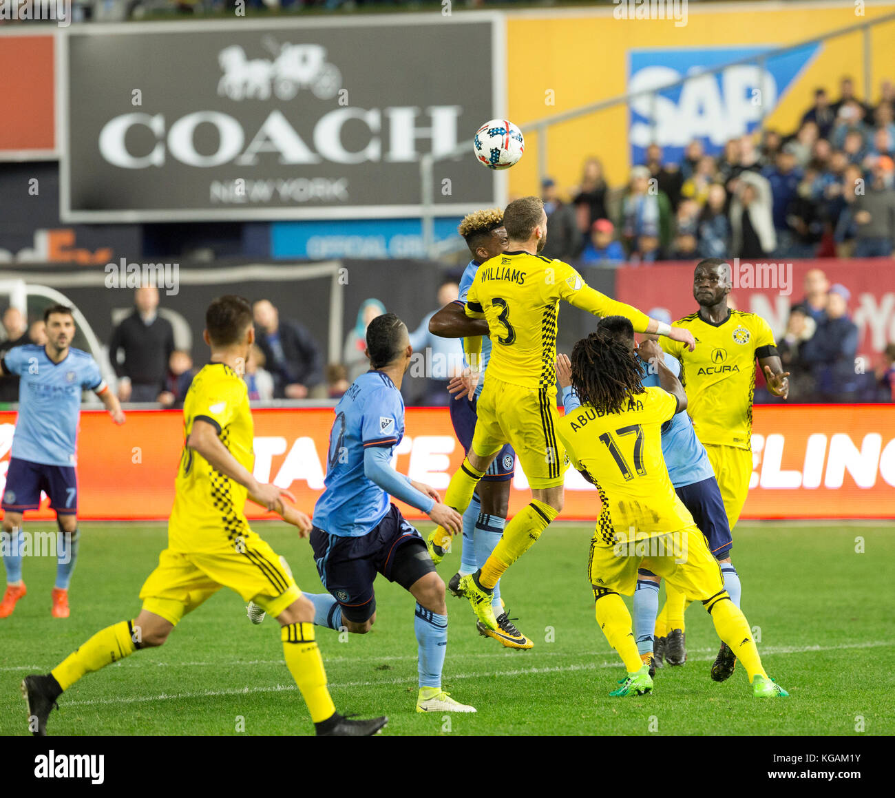 Josh Williams (3) of Columbus Crew & Sean Okoli (9) of NYC FC fight for ...