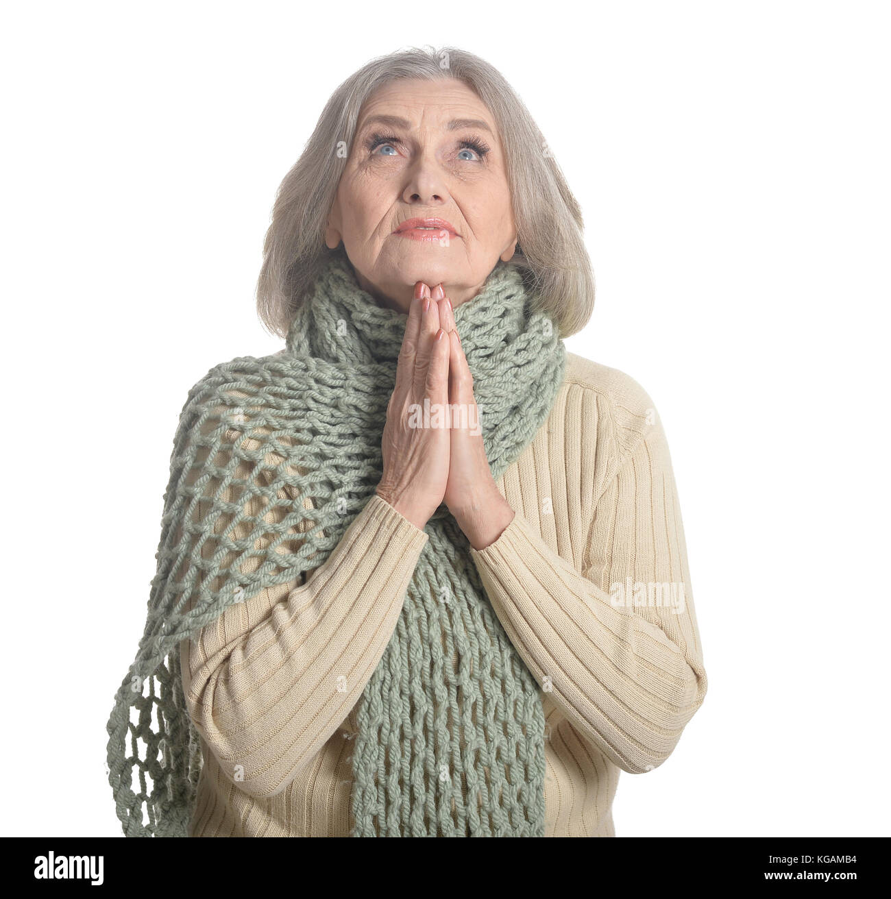 Elderly lady with praying emotions Stock Photo - Alamy