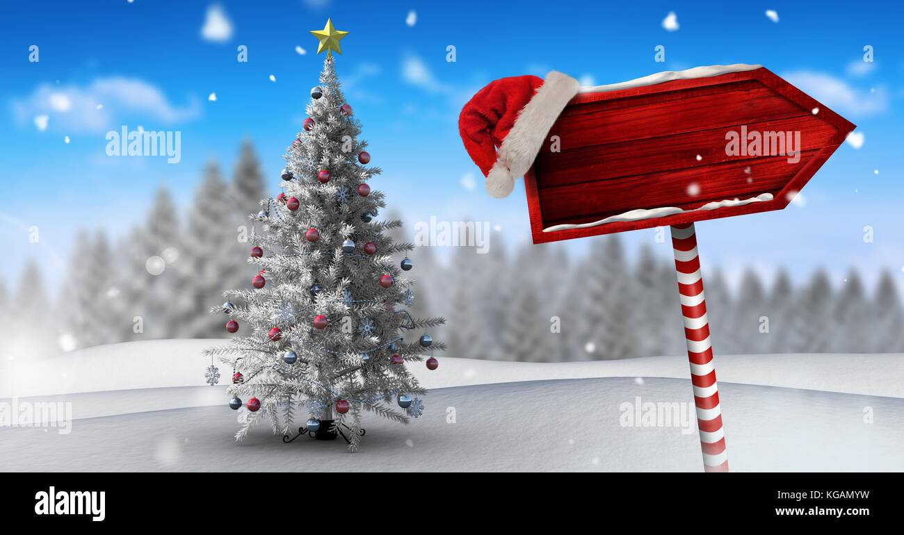 Digital composite of Wooden signpost in Christmas Winter landscape and ...