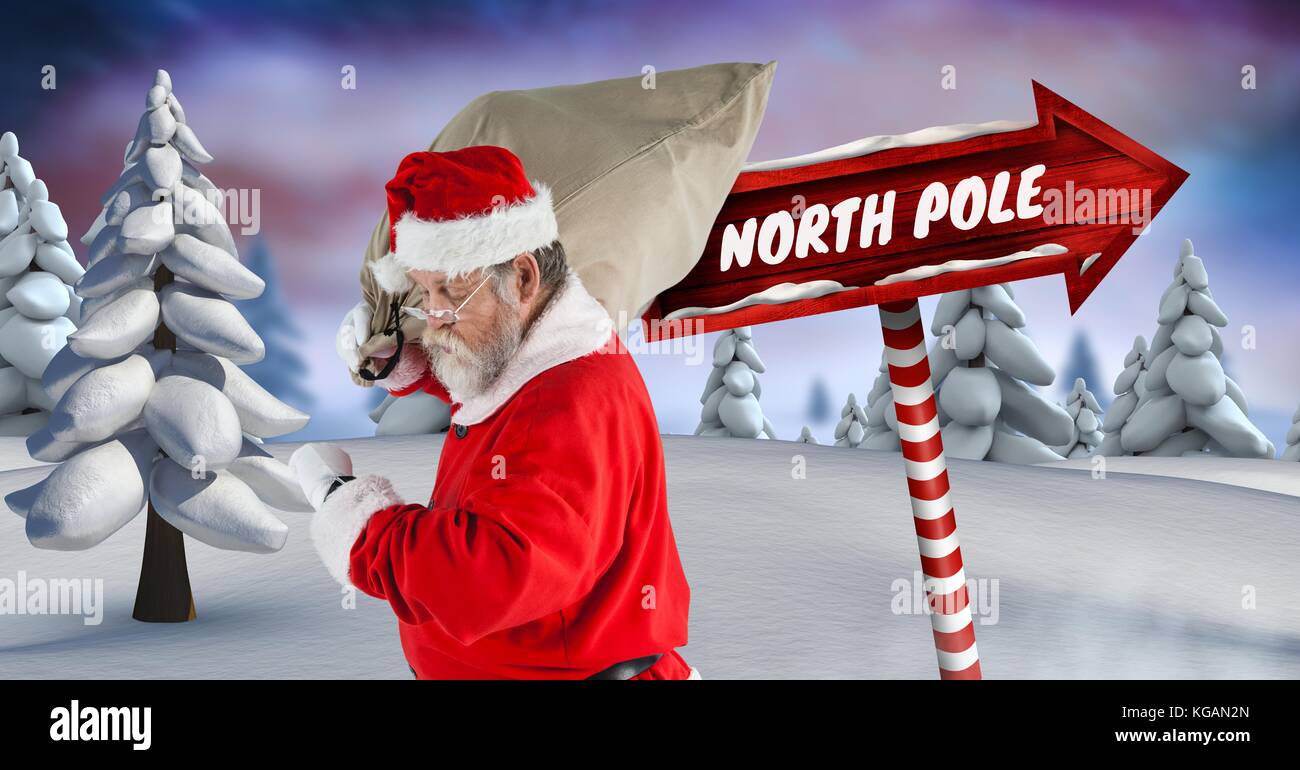 Digital composite of North Pole text and Santa holding sack with Wooden ...