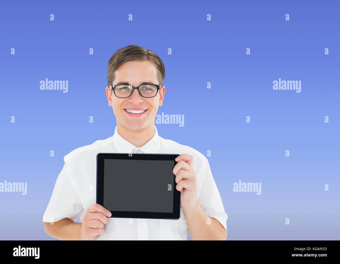 Digital composite of Man holding tablet with blue background Stock ...