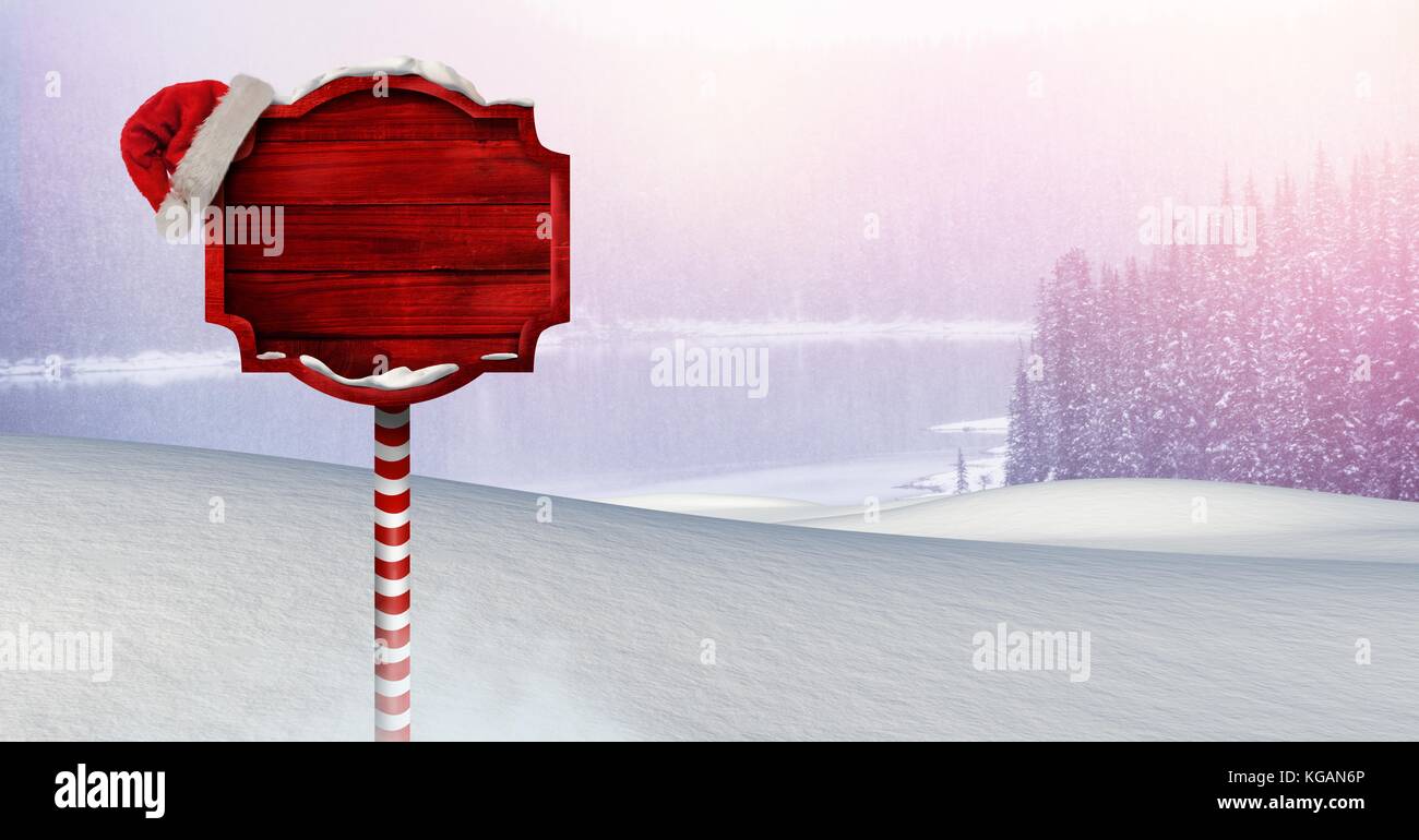 Digital composite of Wooden signpost in Christmas Winter landscape and ...