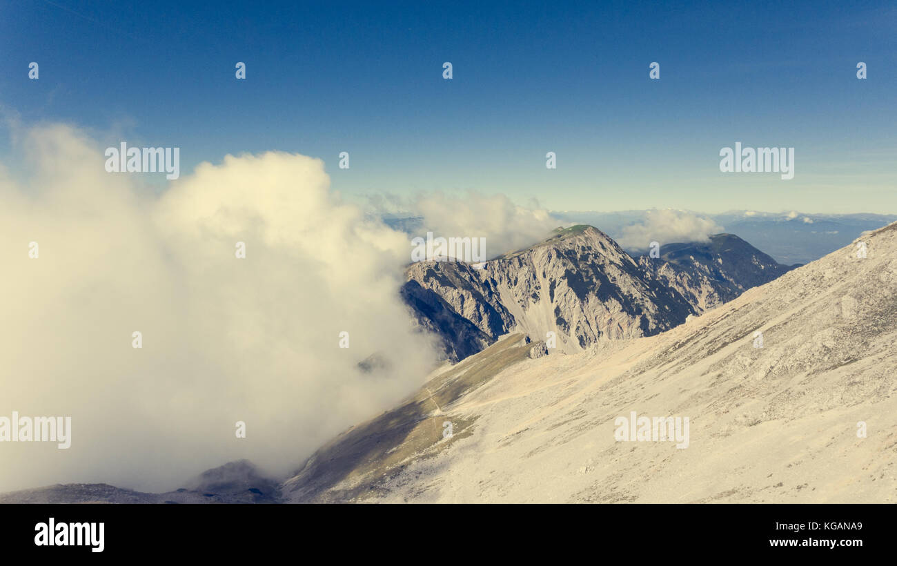 Aerial view of mountain ridge surrounded with clouds Stock Photo - Alamy