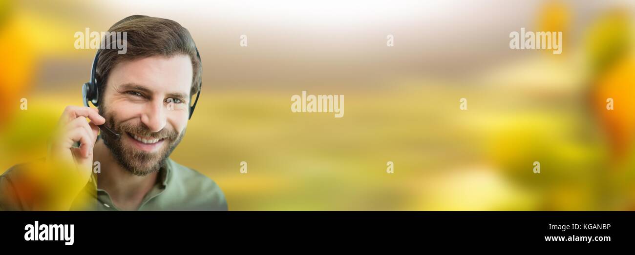 Digital composite of Customer service man's face in landscape with ...