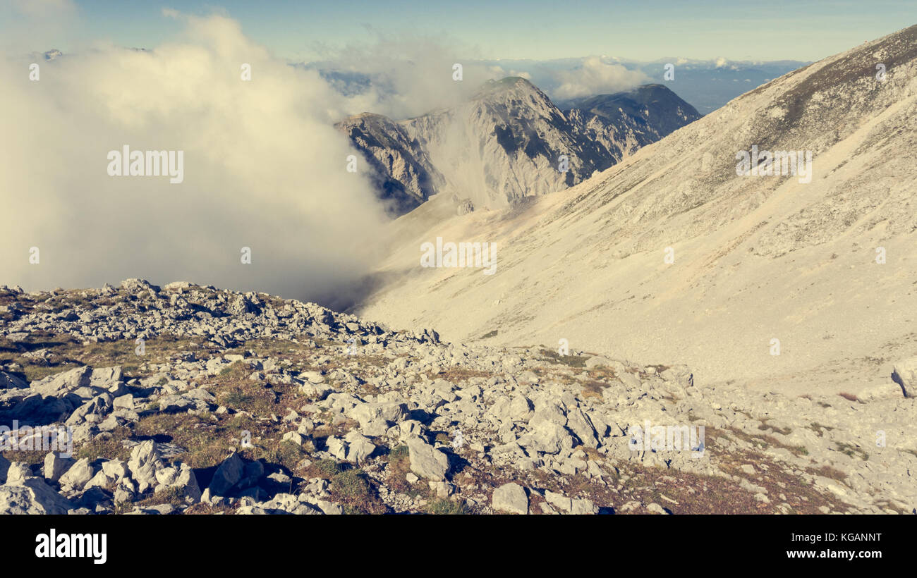 Aerial view of mountain ridge surrounded with clouds Stock Photo - Alamy