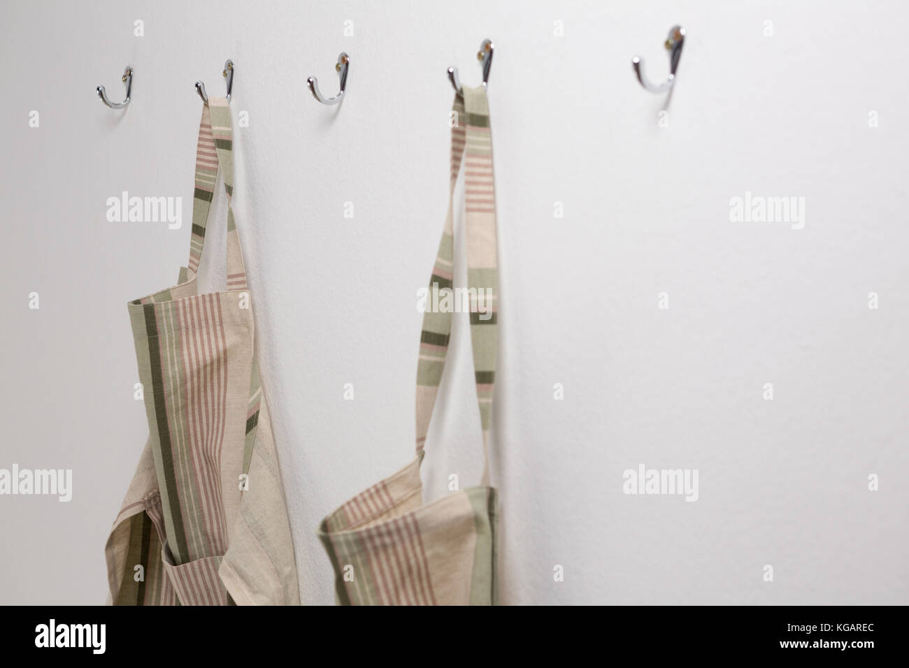 Hanging aprons hi-res stock photography and images - Alamy