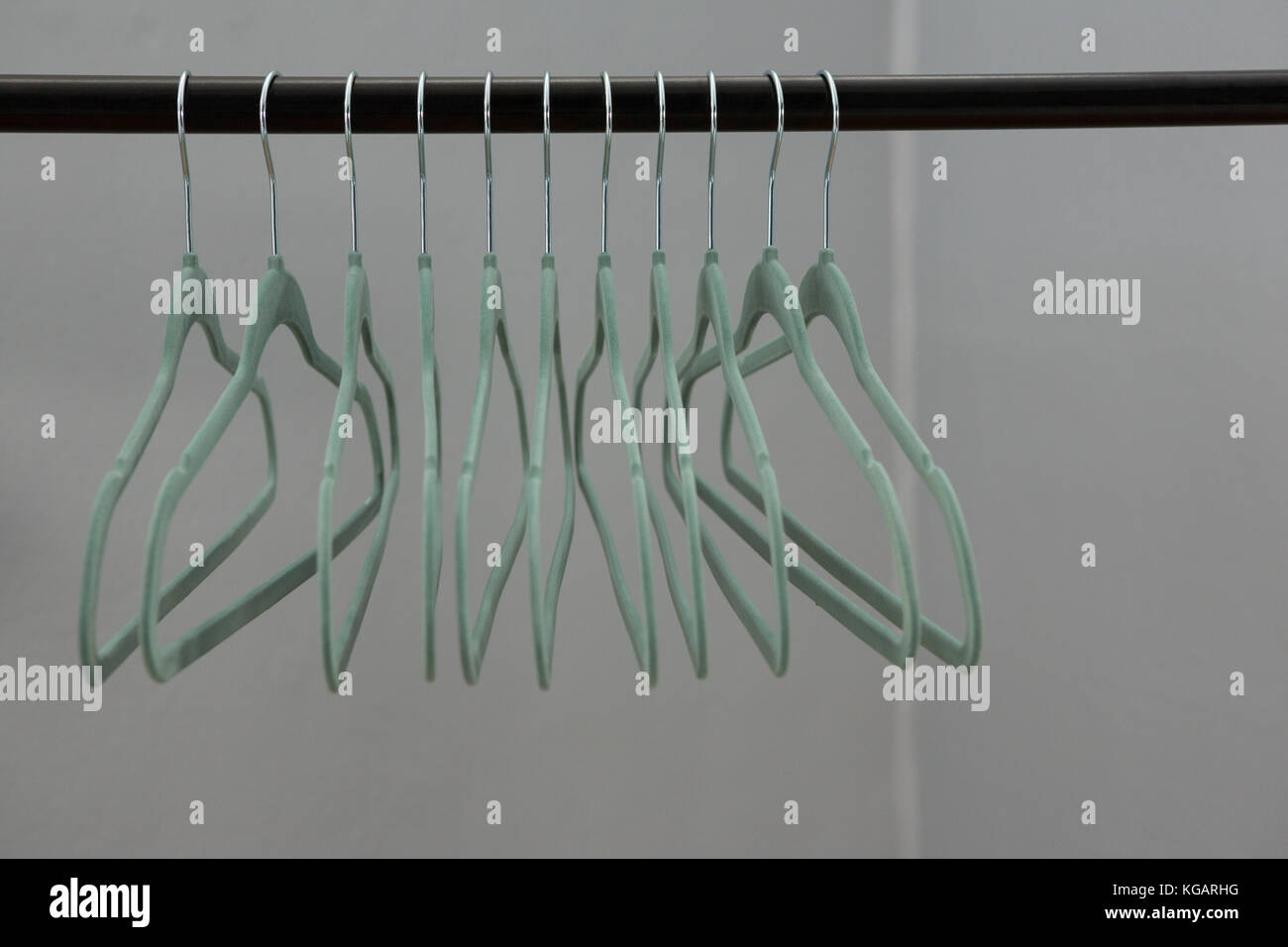 Close-up of empty cloth hangers Stock Photo - Alamy
