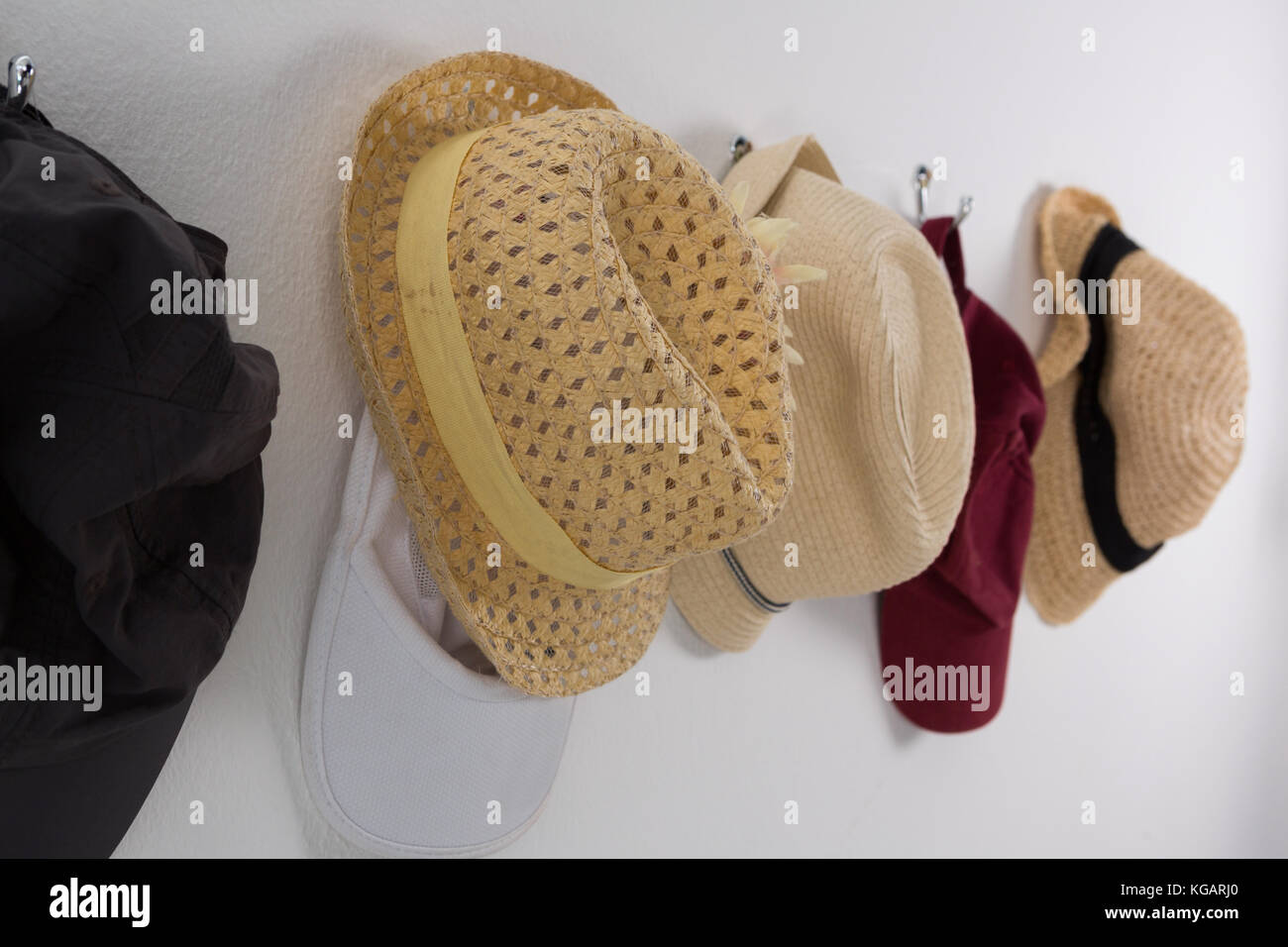 Cap hanging on hook hi-res stock photography and images - Alamy