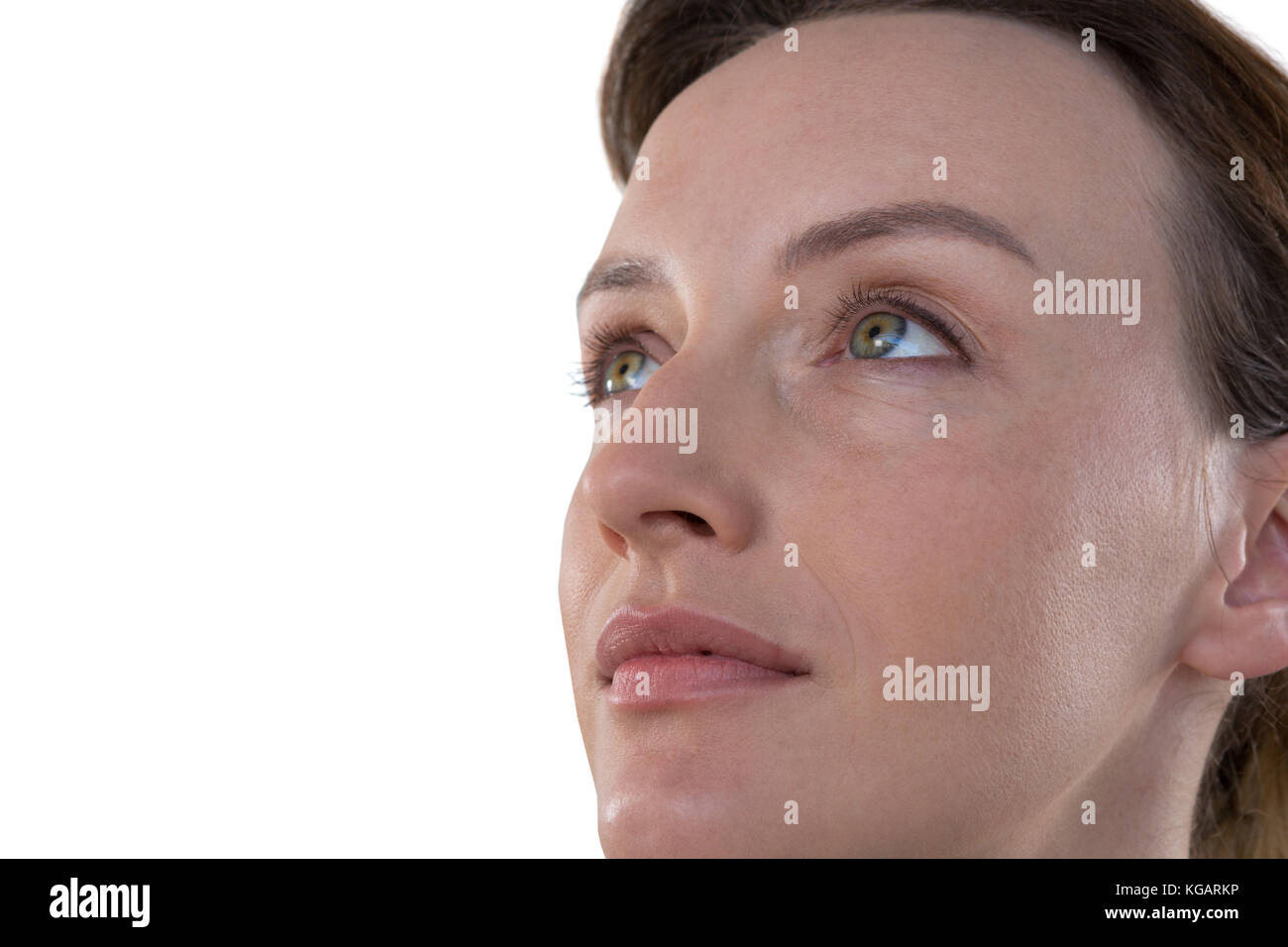 Thoughtful woman looking away against white background Stock Photo - Alamy