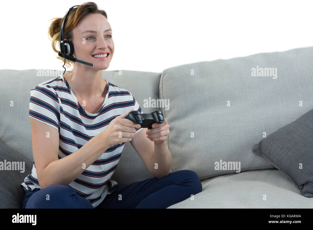 Woman in headphones playing video game against white background Stock ...