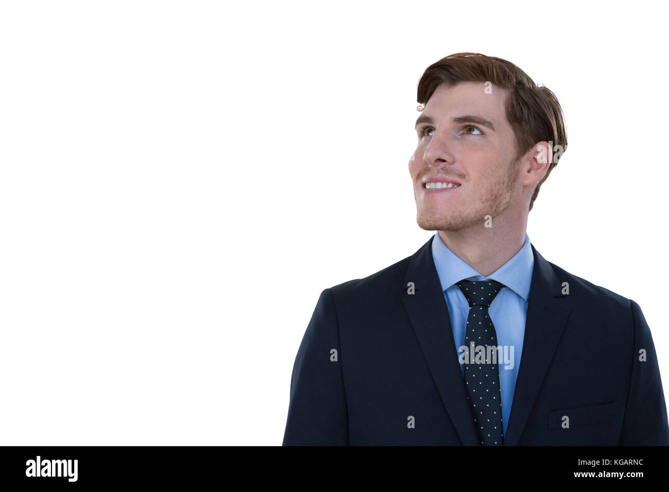 Thoughtful businessman smiling against white background Stock Photo - Alamy