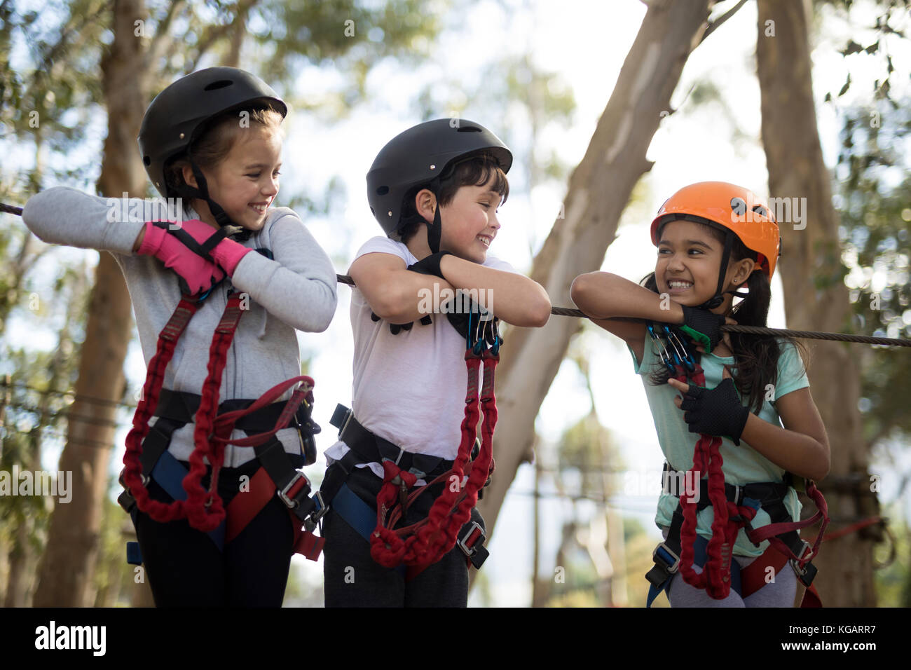 Happy kids interacting with each other on cable Stock Photo - Alamy