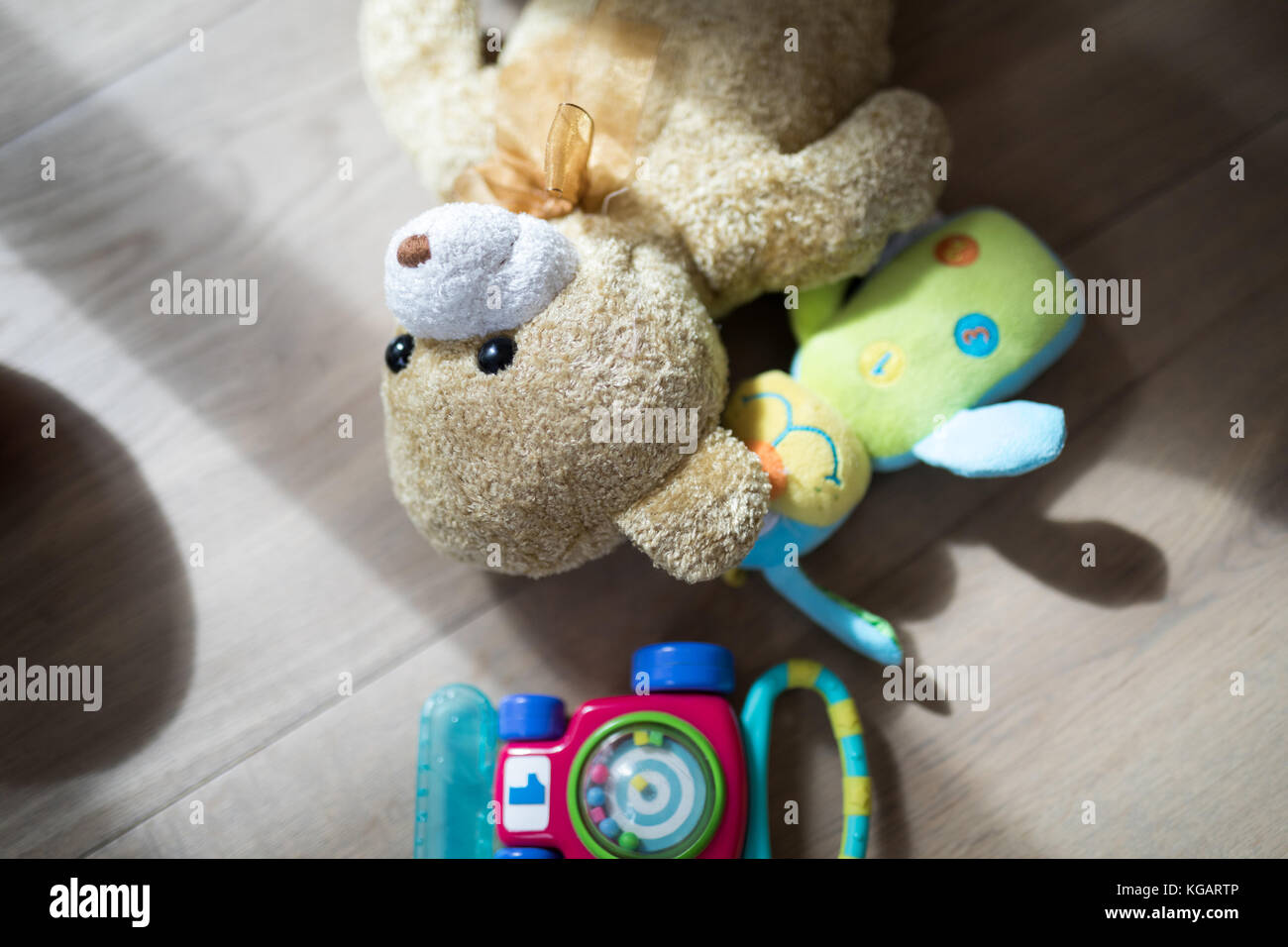 Overhead of toys on wooden floor Stock Photo - Alamy
