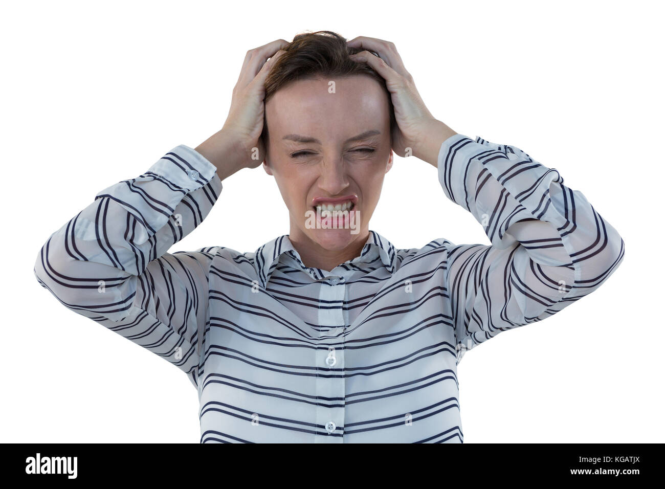 Frustrated female executive standing against white background Stock ...