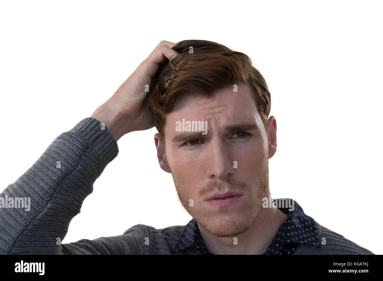 Confused male executive standing against white background Stock Photo ...