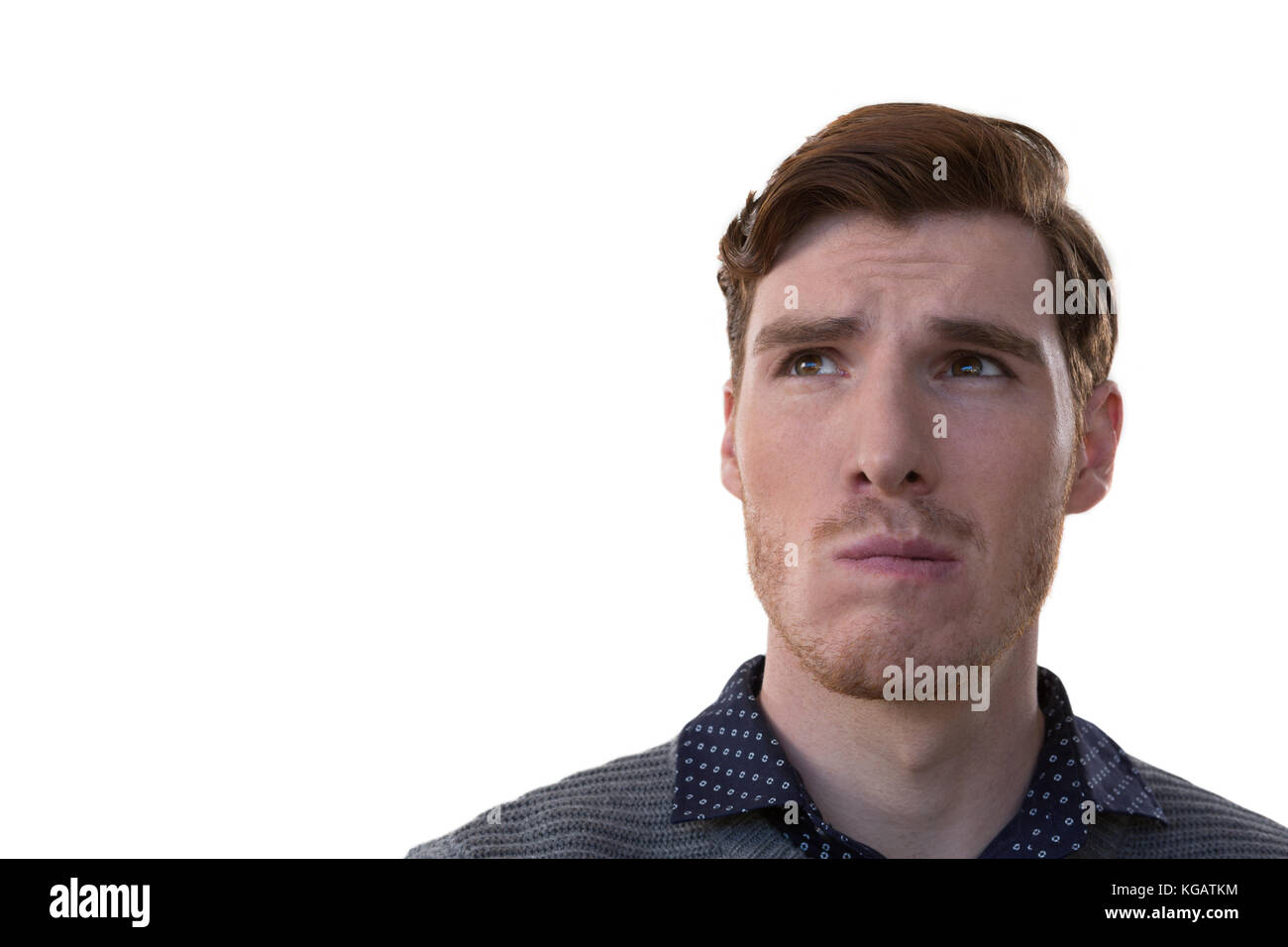 Confused male executive standing against white background Stock Photo ...