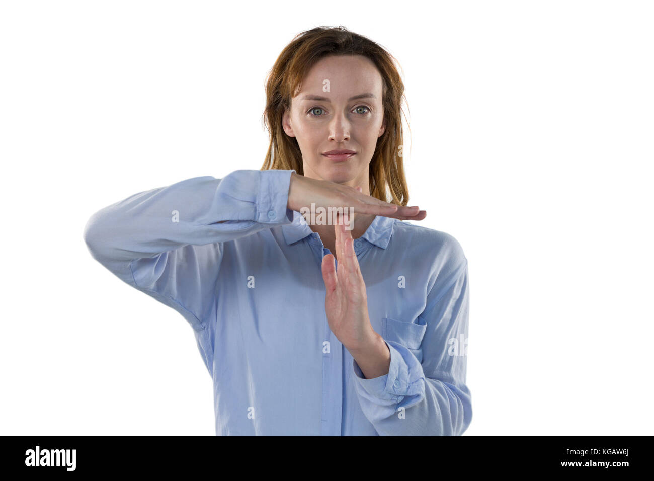 Female executive making time out sign against white background Stock ...
