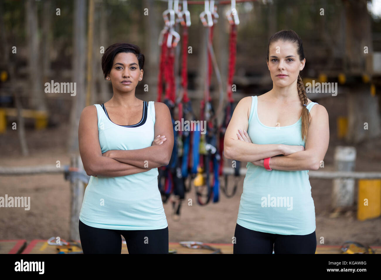 Portrait of confident friends standing with arms crossed Stock Photo ...